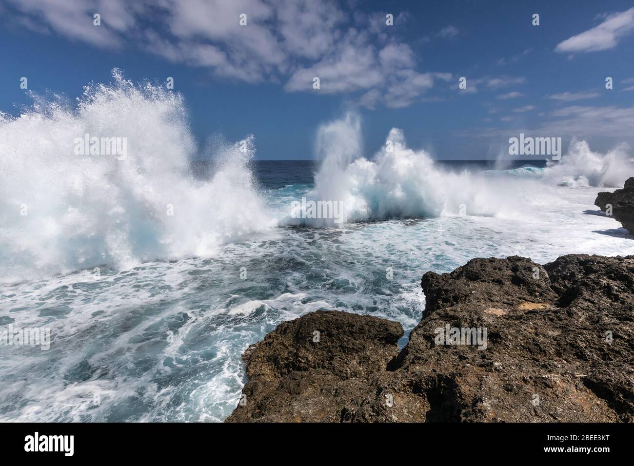 Tongatapu blowholes splashing water big waves limestone rocks Tonga ...