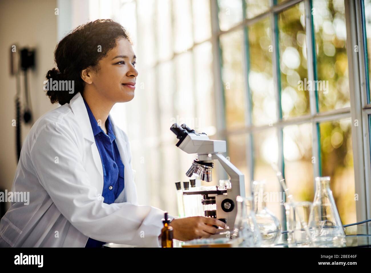 Microscope white coat smiling medical hi-res stock photography and ...