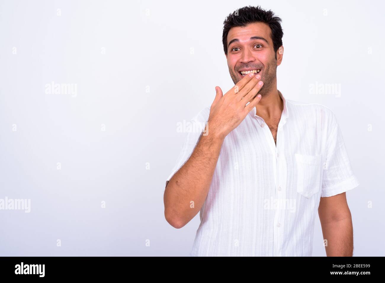 Portrait of happy handsome Turkish man looking surprised Stock Photo ...