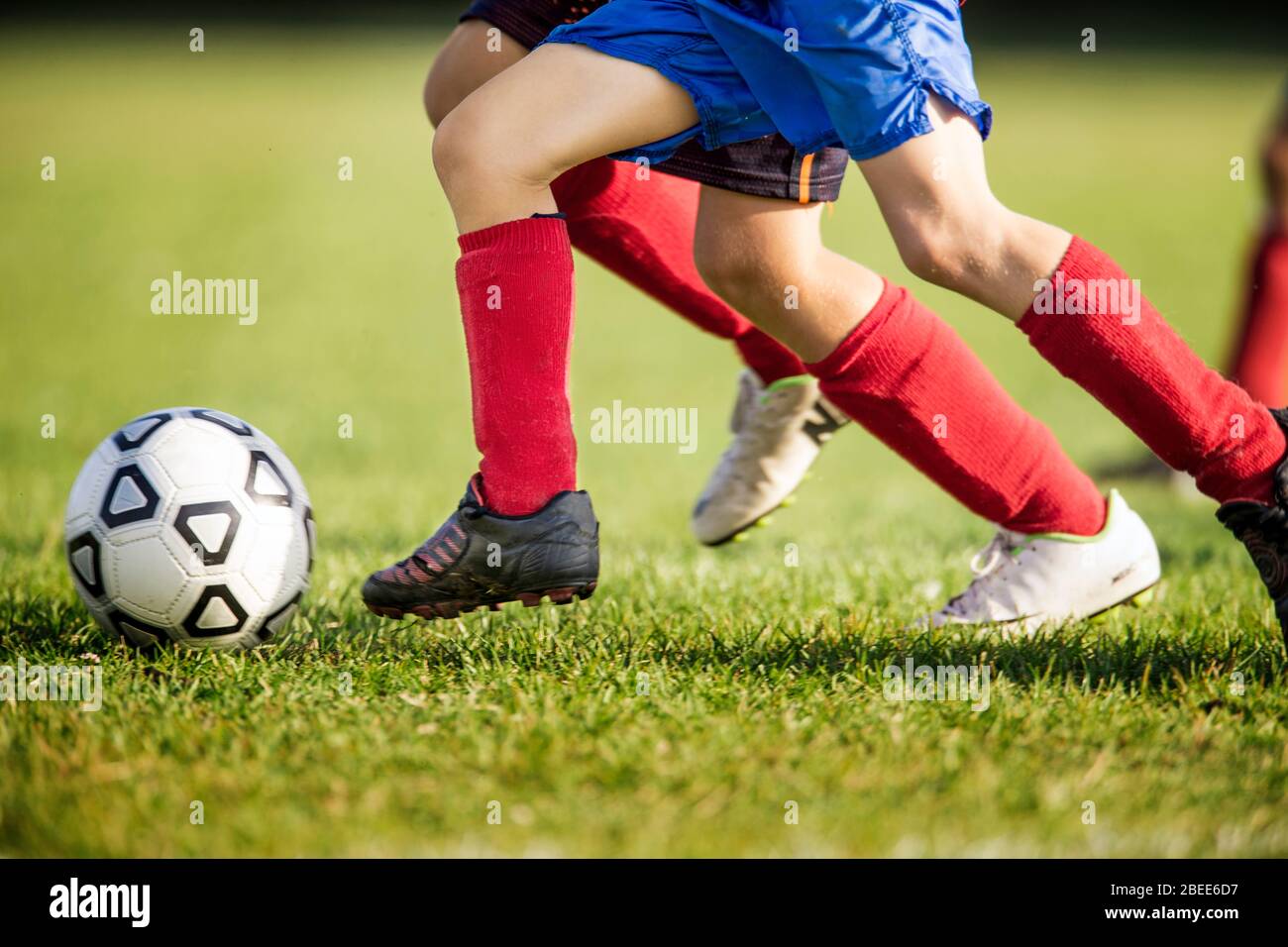 Boys playing soccer Stock Photo - Alamy