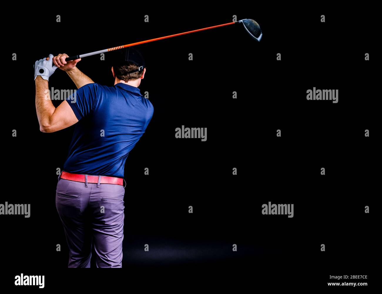 Close-up of a golf player intent on perfecting the swing isolated on ...