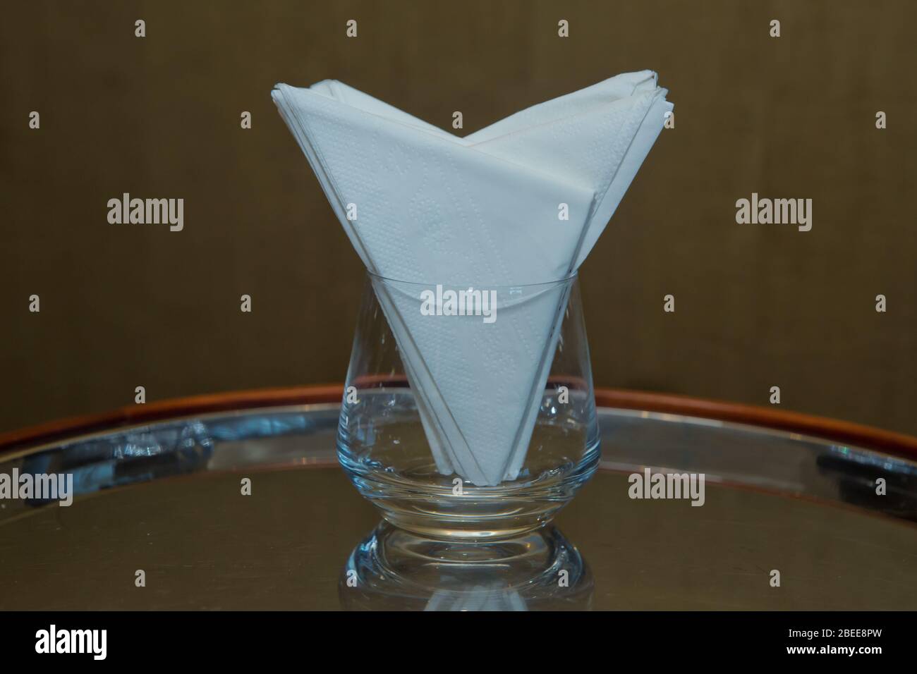 blur image - White paper napkin is placed in a glass on the table in ...