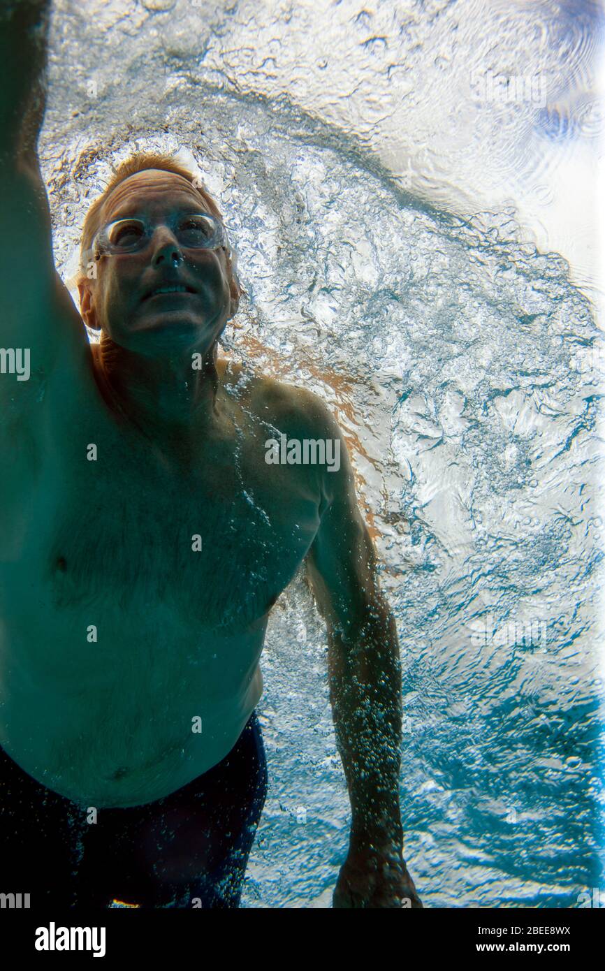 Male swimmer swimming the front crawl Stock Photo - Alamy