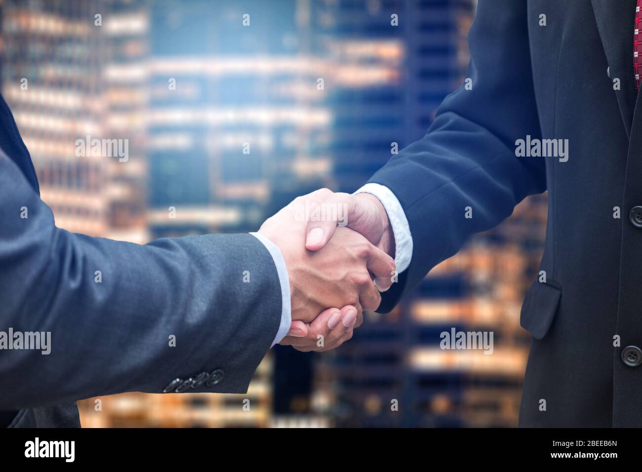 Businessman partnership meeting handshake in the city office building ...