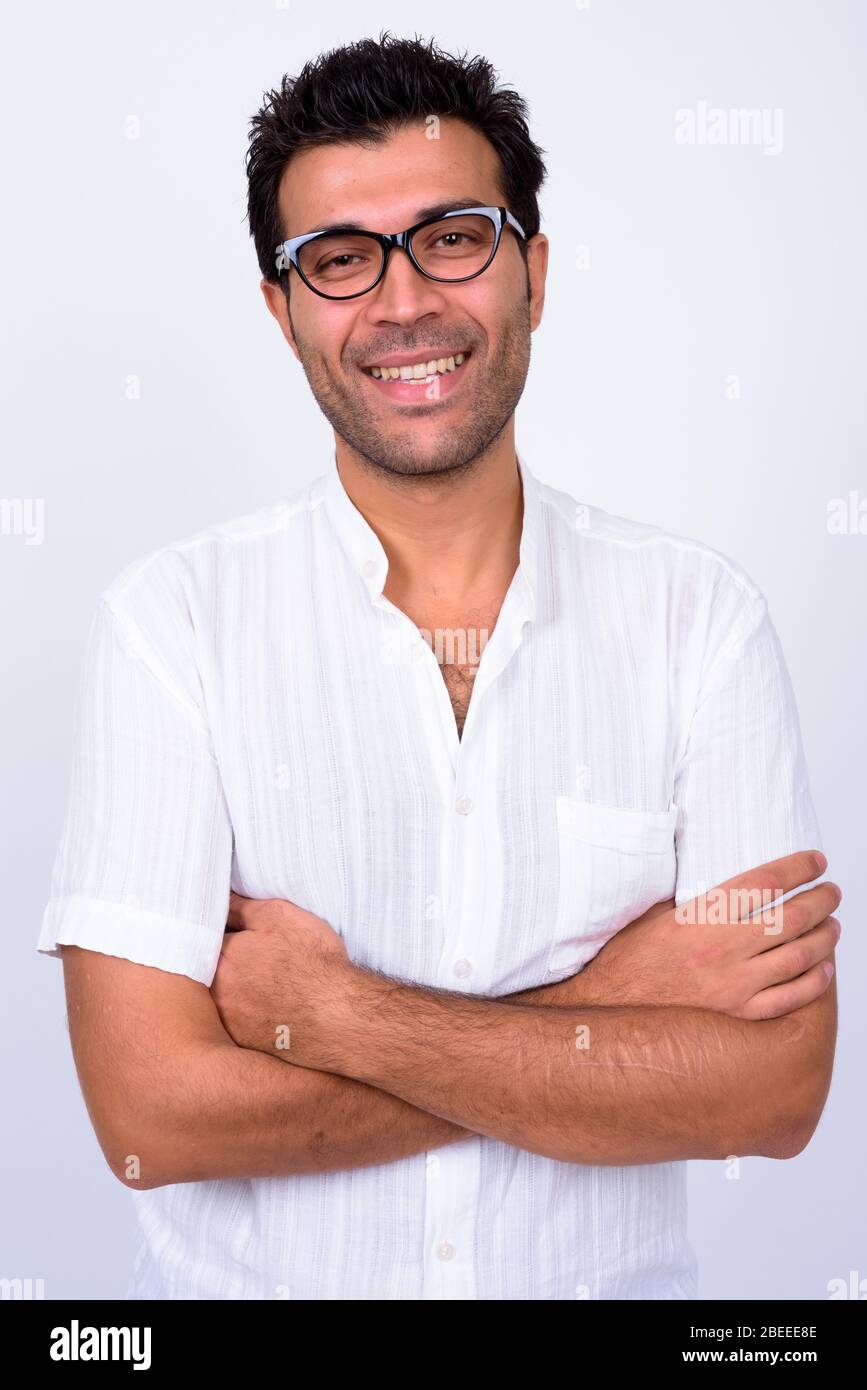 Portrait of happy handsome Turkish man with arms crossed Stock Photo ...