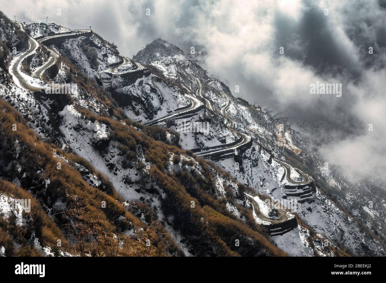 Famous Zigzag himalayan mountain road of Zuluk, covered with snow with copy space Stock Photo ...