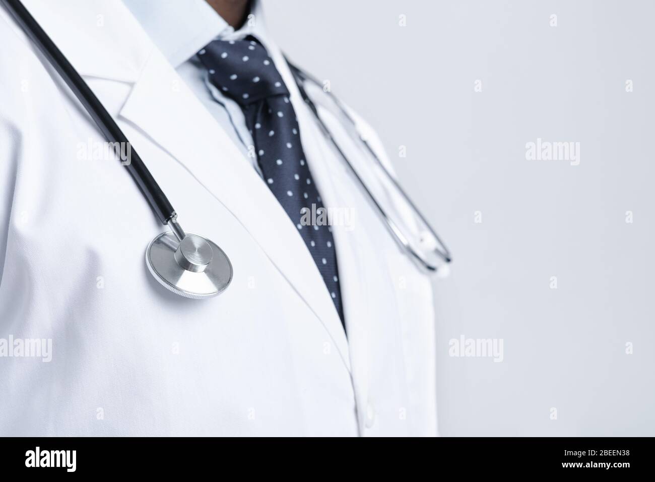 Doctor in white robe with stethoscope on his chest Stock Photo - Alamy