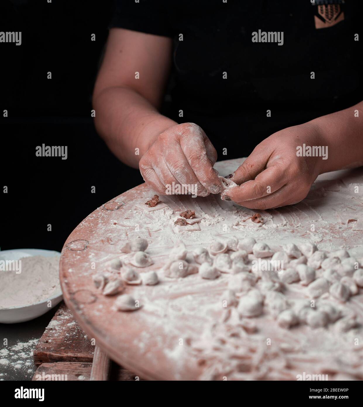 cook made Dushbara meal , Dough With Meat Stock Photo - Alamy