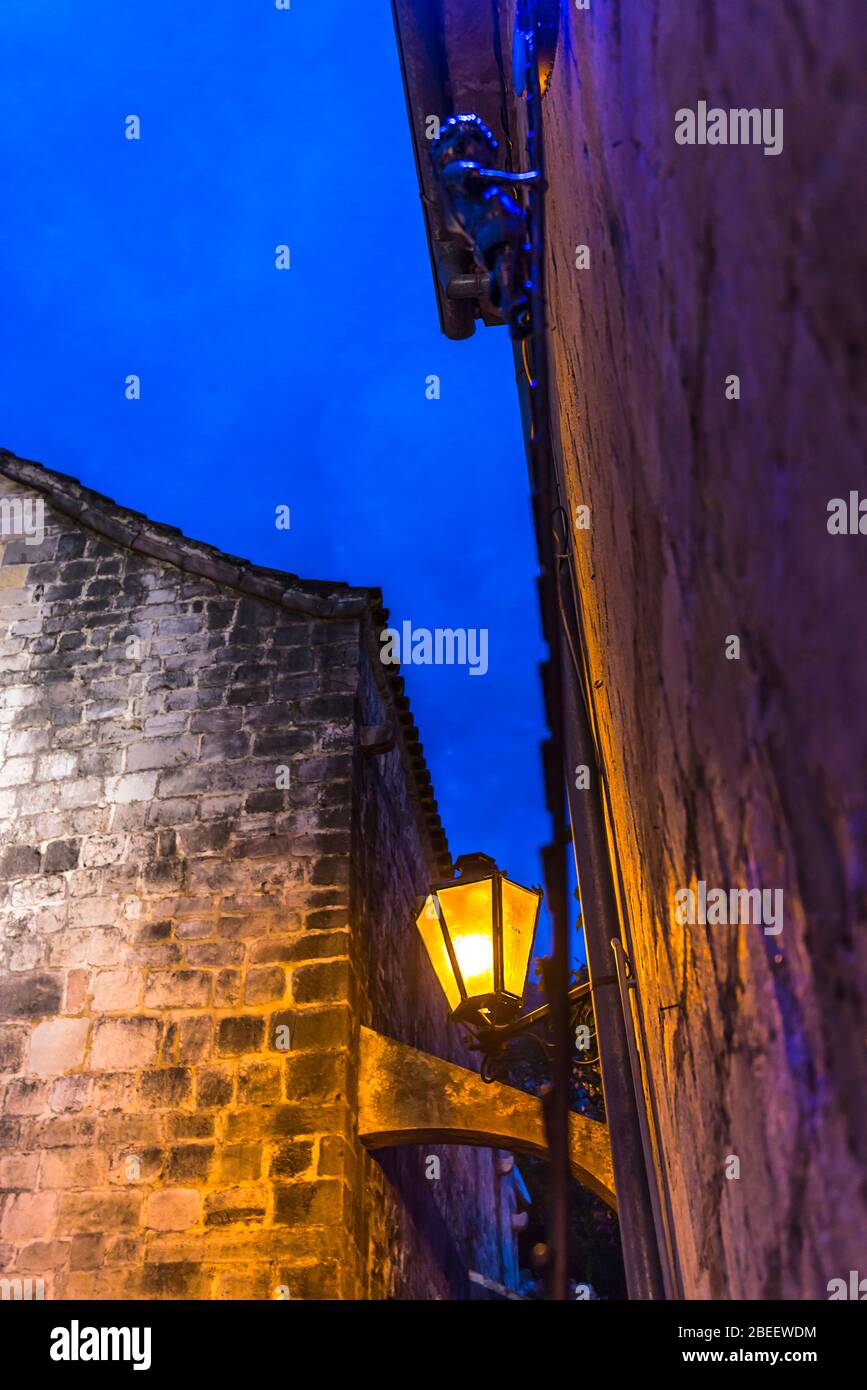 the old town of Kotor. Metal figure of a man climbing the stairs. night ...