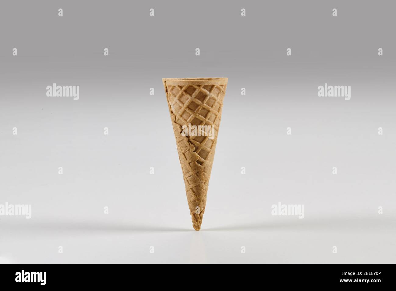 Empty small wafer cone for ice cream isolated on white. Concept of food ...