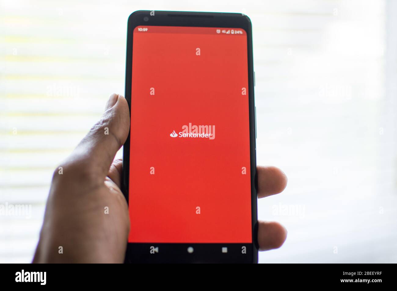Santander app loading on a phone Stock Photo - Alamy