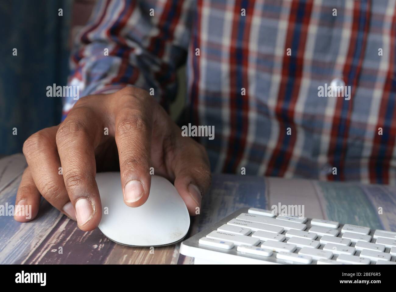 Close up man hand using computer mouse Stock Photo - Alamy