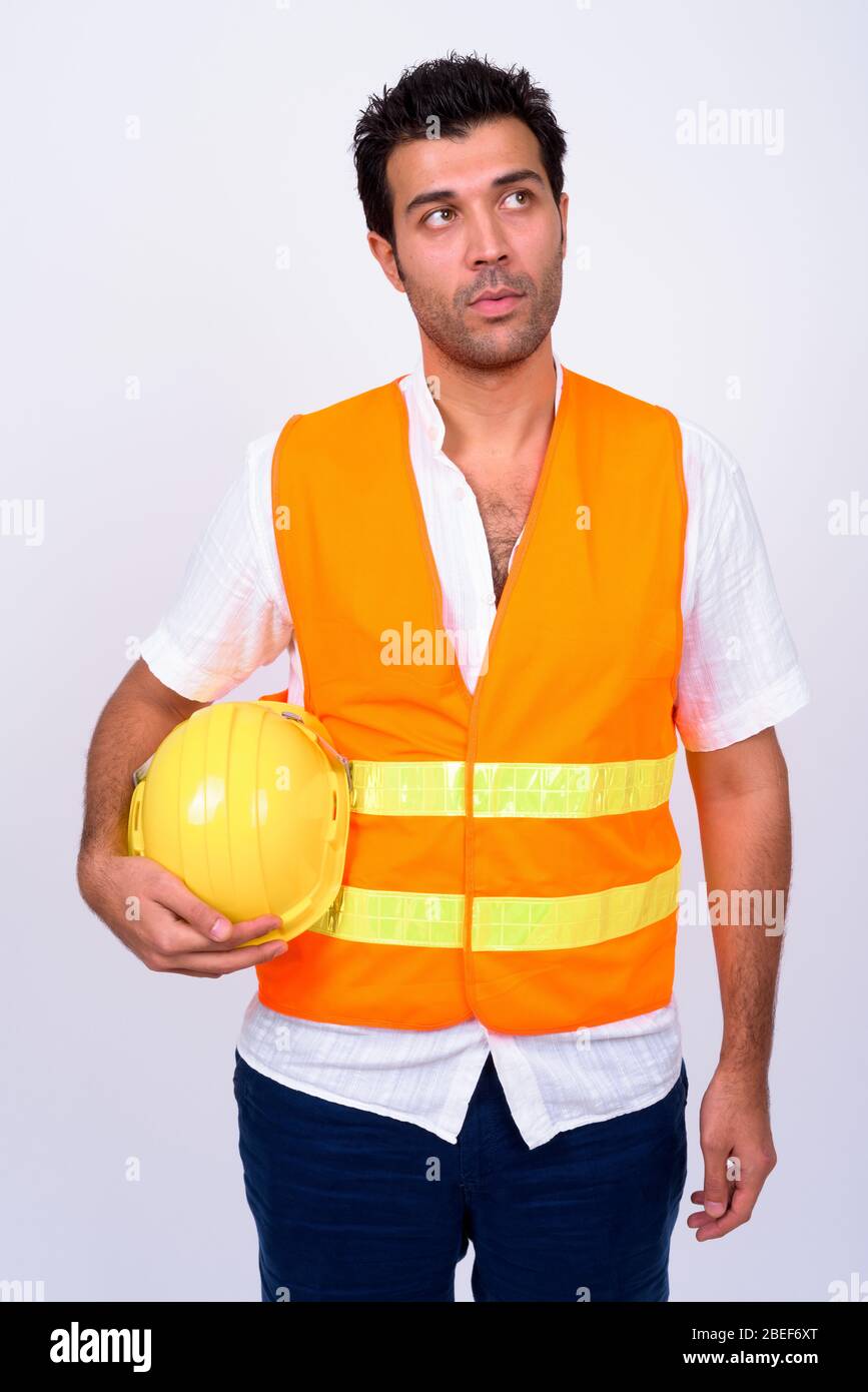 Handsome Turkish man construction worker against white background Stock ...