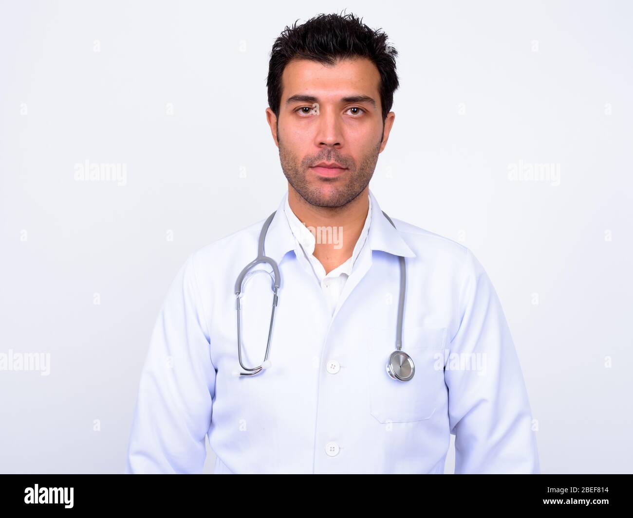 Handsome Turkish man doctor against white background Stock Photo - Alamy