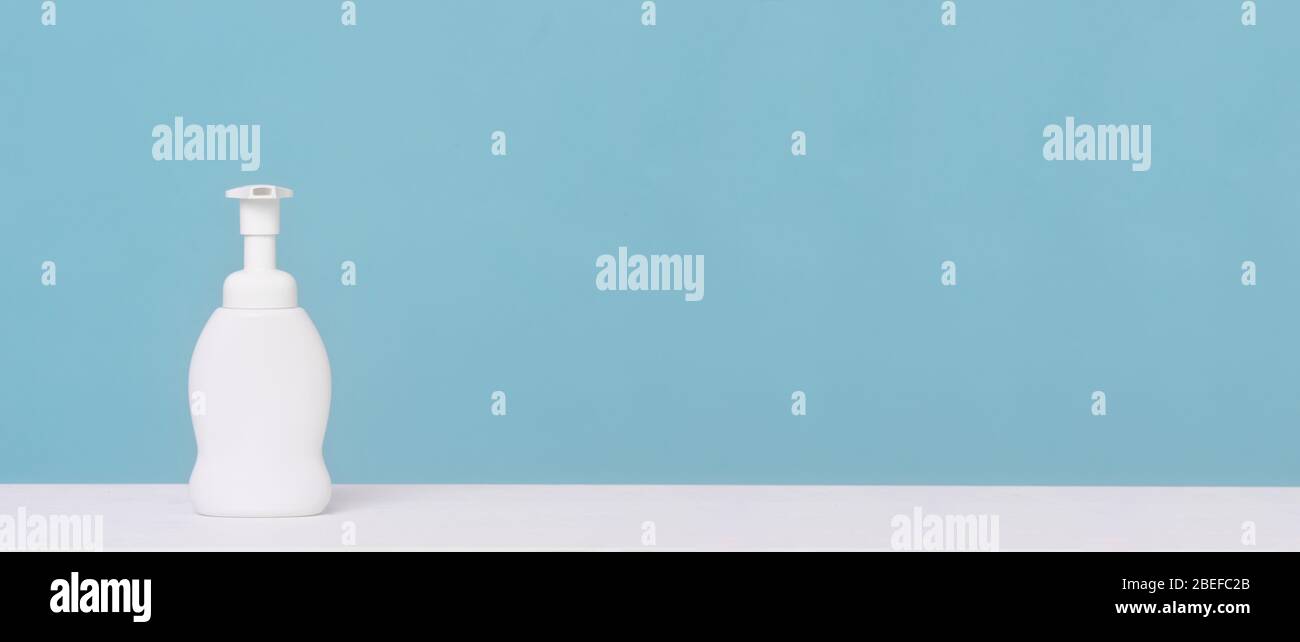 Hand sanitizer bottle or alcohol gel on mint color background ...