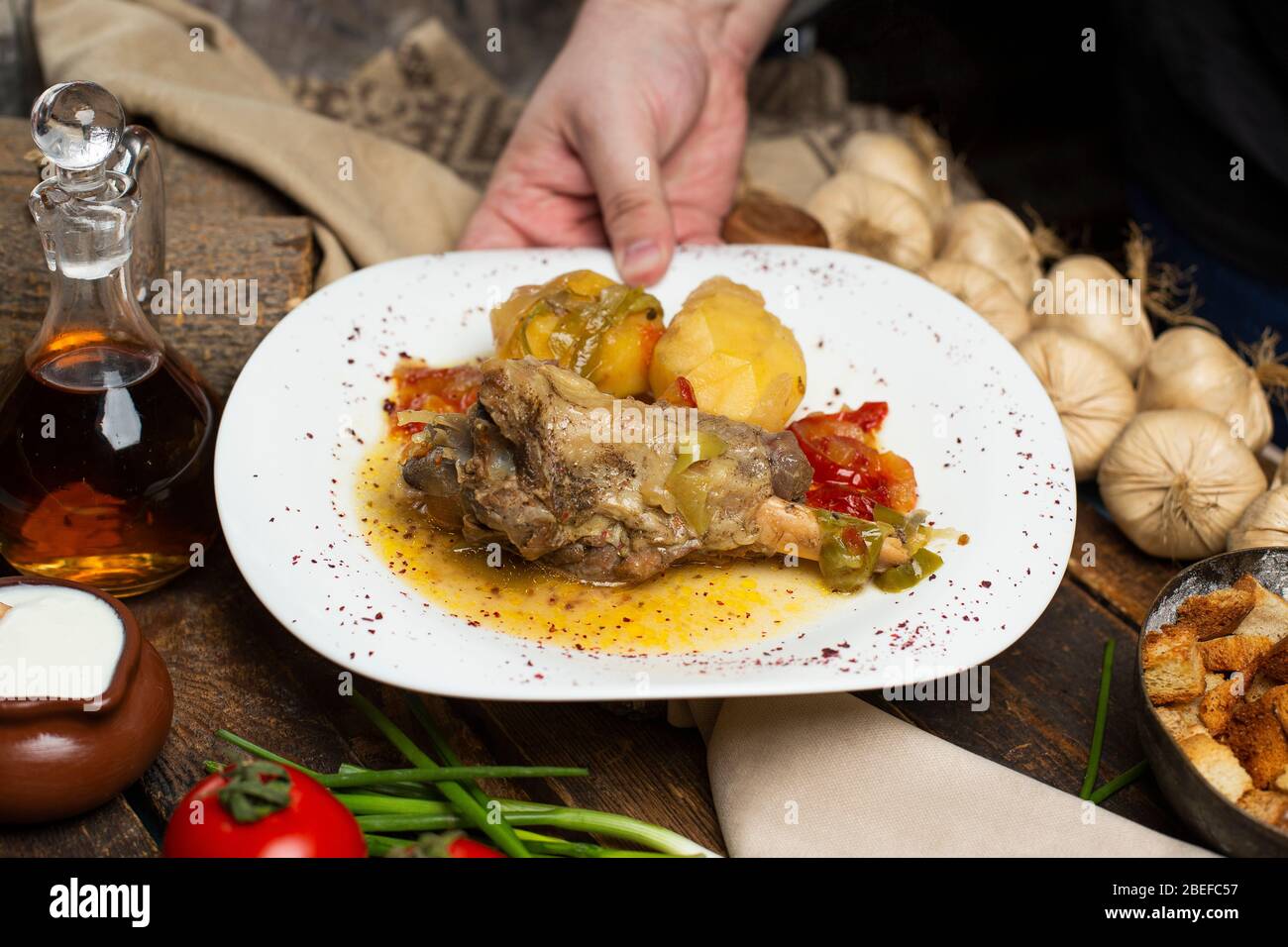 delicious meat and potato meal with wooden background Stock Photo - Alamy