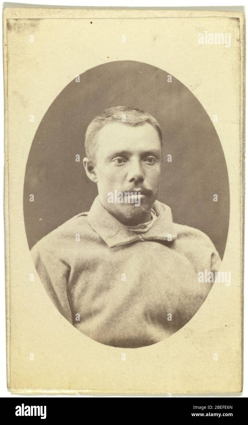 Head-and-shoulders portrait of a man, dressed in convict clothing ...