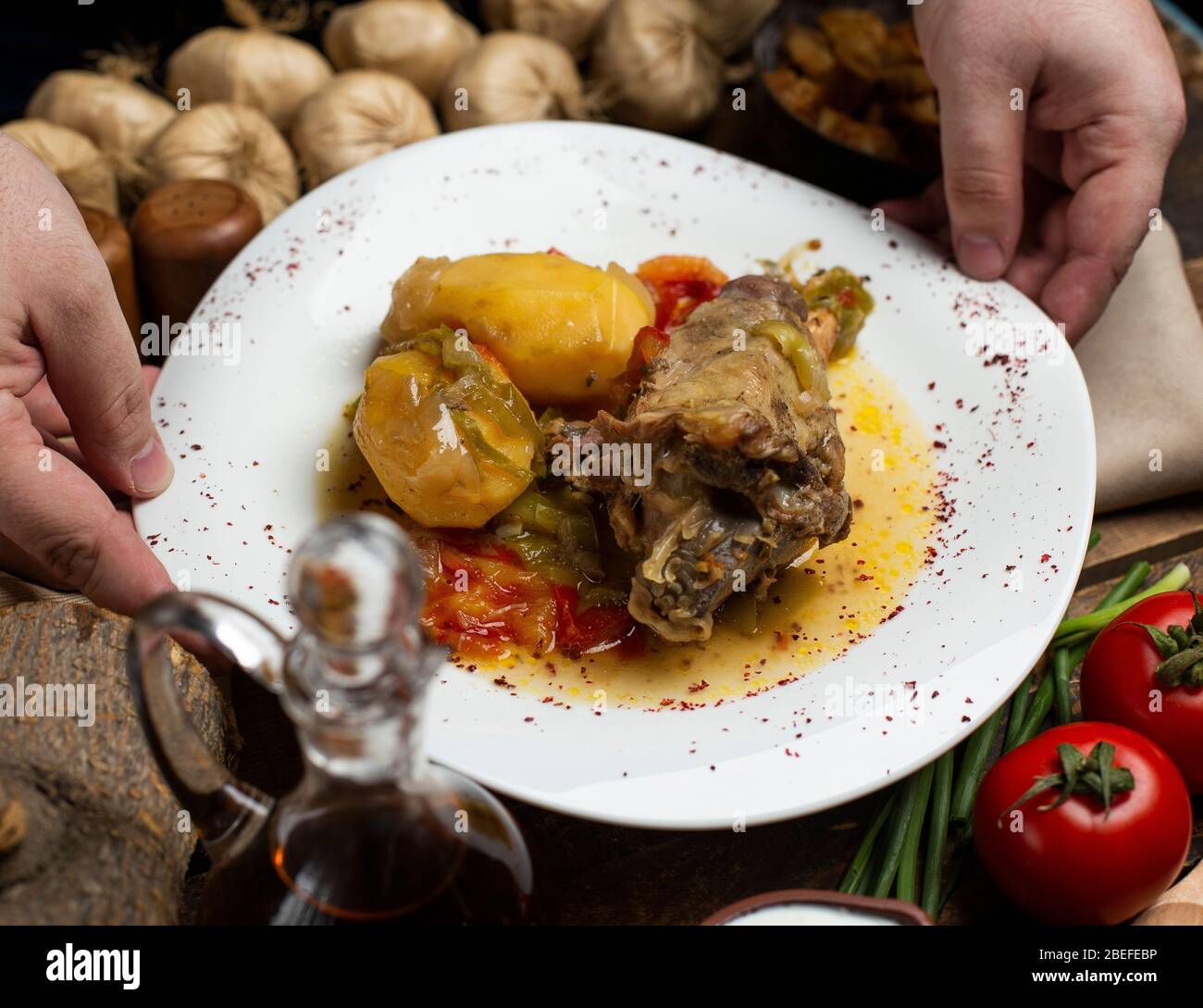 delicious meat and potato meal with wooden background Stock Photo - Alamy