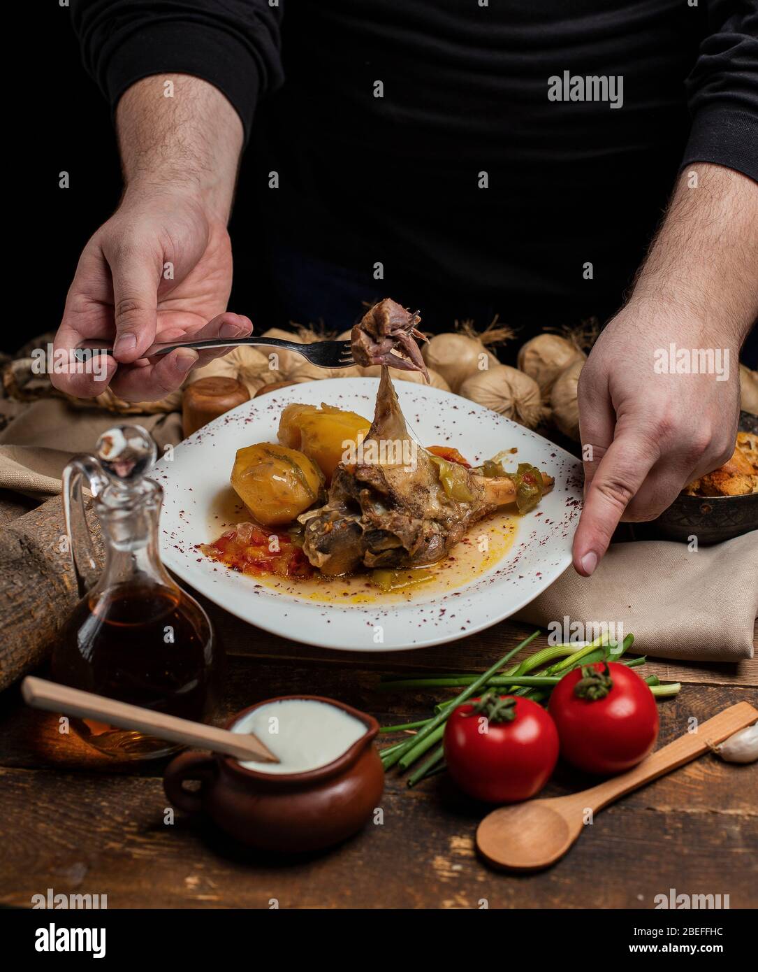 delicious meat meal with garlic on dark background Stock Photo - Alamy