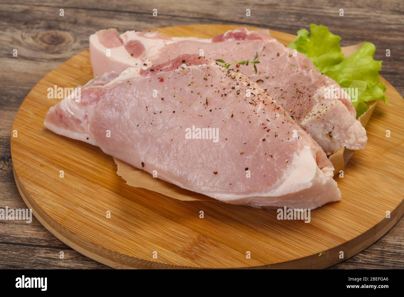 Raw pork meat steak ready for grill Stock Photo - Alamy