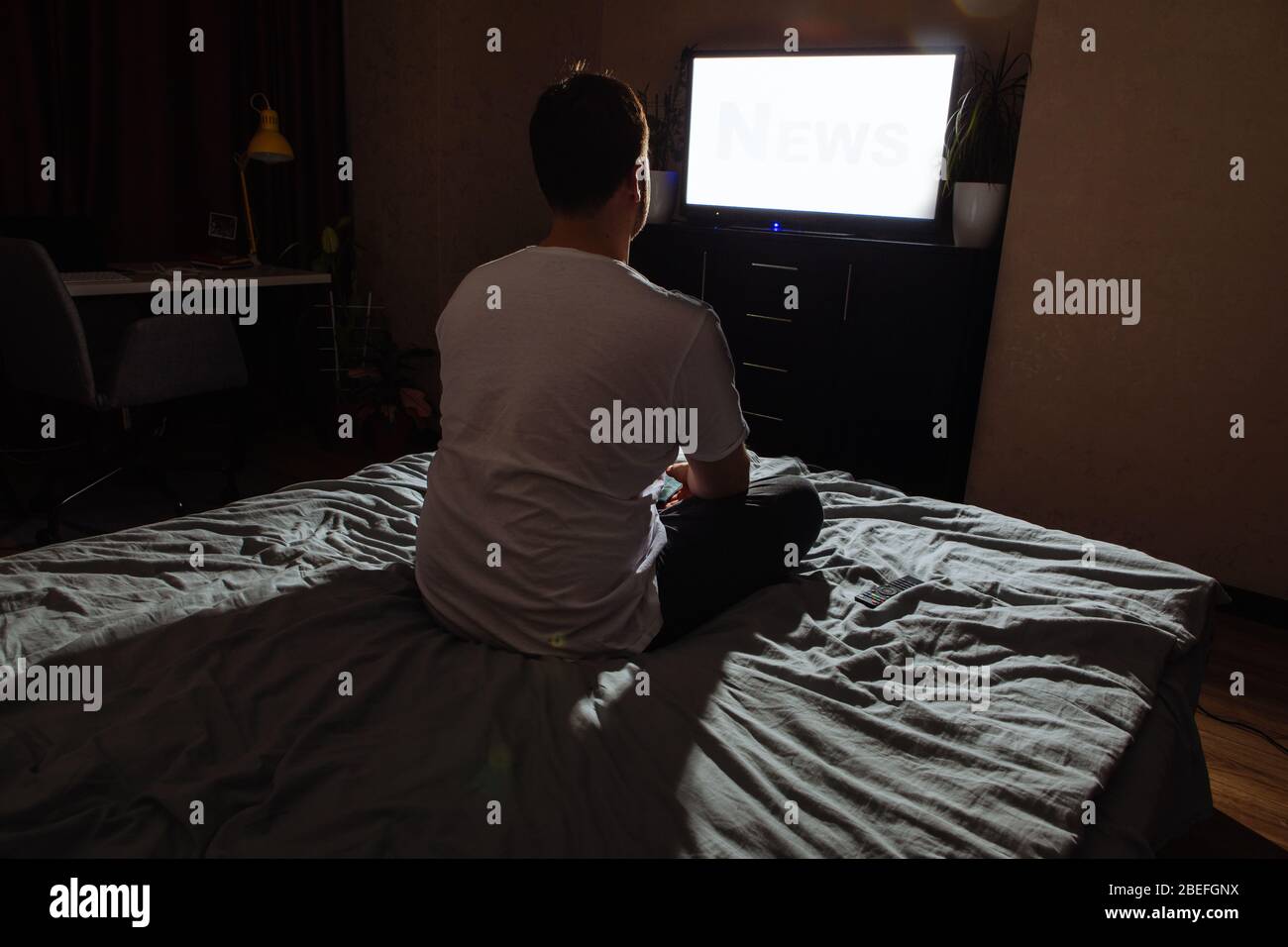 Person watching tv from behind hi-res stock photography and images - Alamy