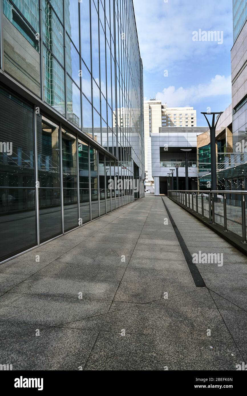 Promenade between modern buildings with glass walls in Poznan Stock ...
