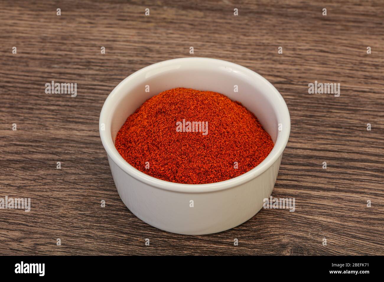 Dry paprika powder in the bowl for cooking Stock Photo - Alamy