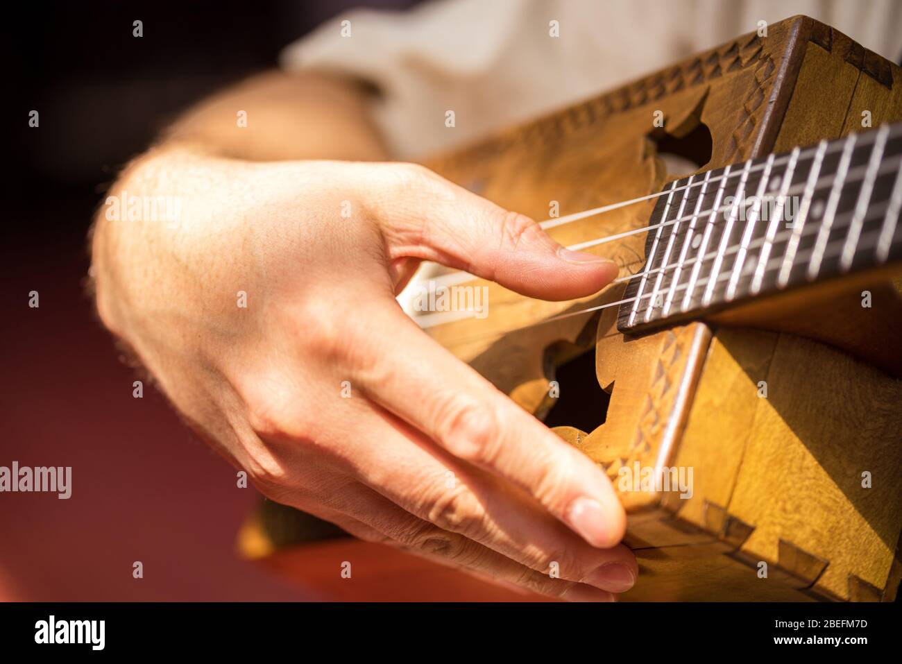 Close up male fingers of guitarist strumming the strings Stock Photo ...