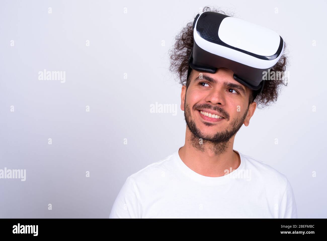 Face of handsome bearded Turkish man with curly hair Stock Photo - Alamy