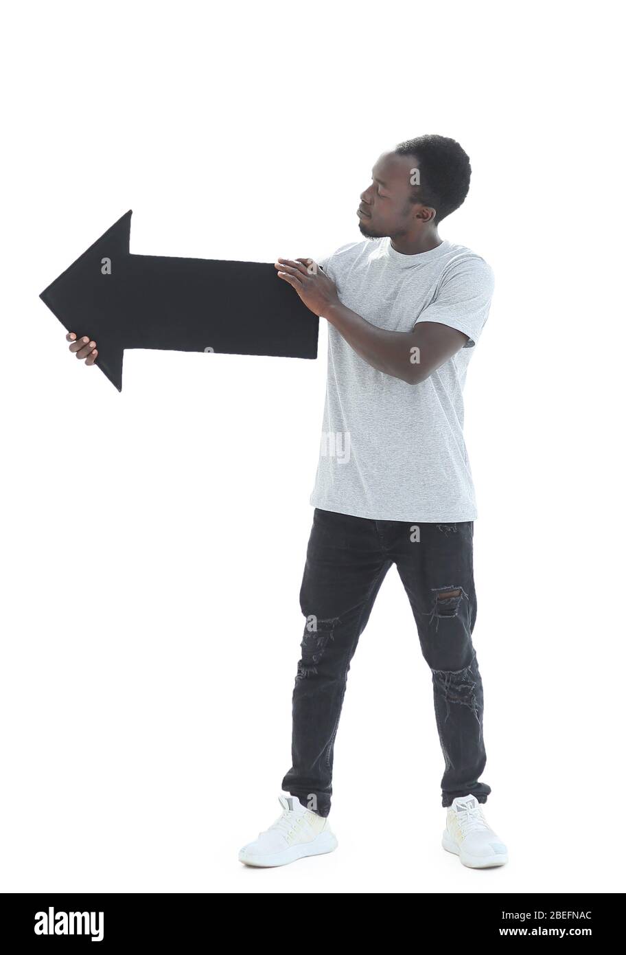 in full growth. casual guy pointing in the right direction Stock Photo ...