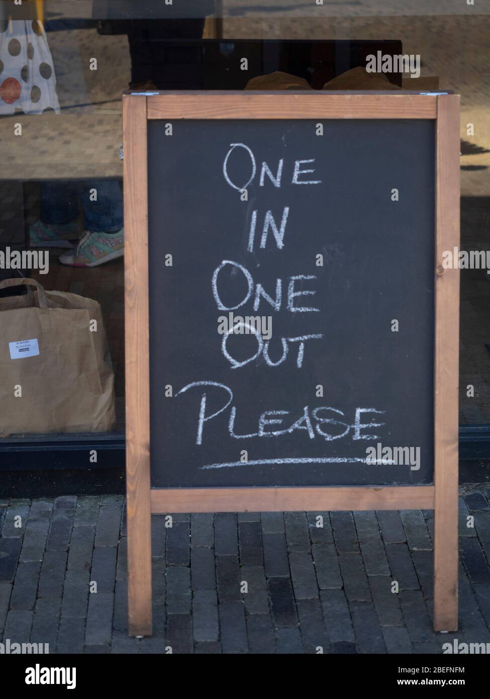 Close-up of queue black board sign Stock Photo - Alamy