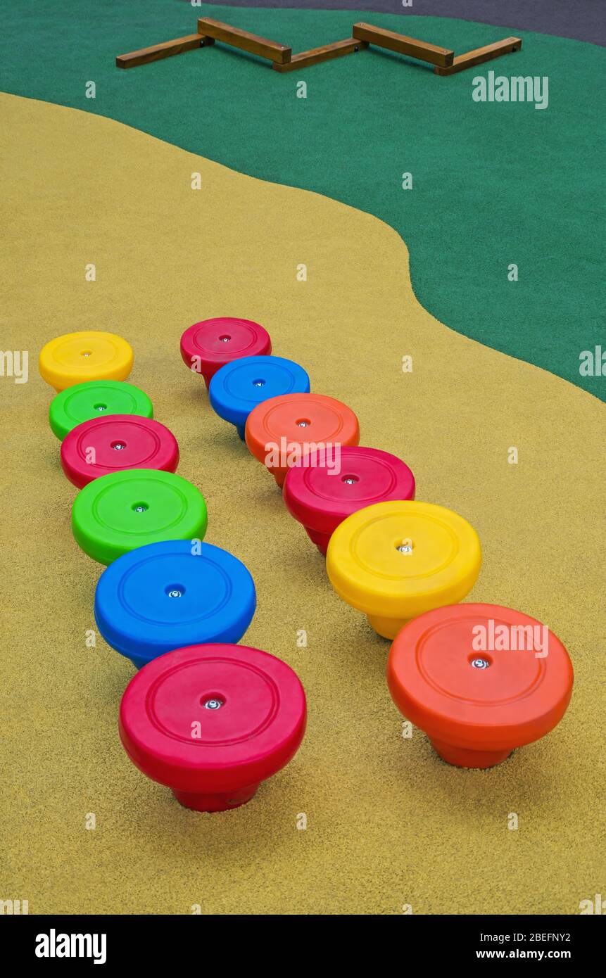 Childish playground with multi-colored plastic stumps for climbing and ...