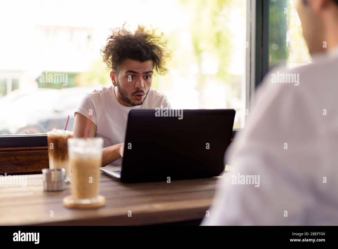 Two handsome Turkish men hanging out and relaxing at the coffee shop ...