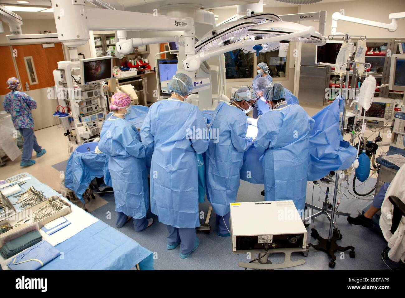 An operating room team during operation to remove blockage from patient ...