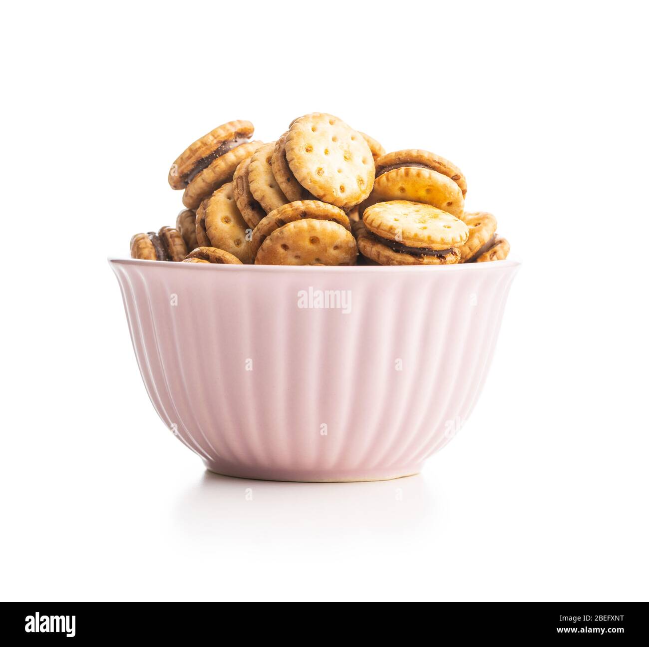 Mini cream sandwich cookies in bowl isolated on white background Stock ...