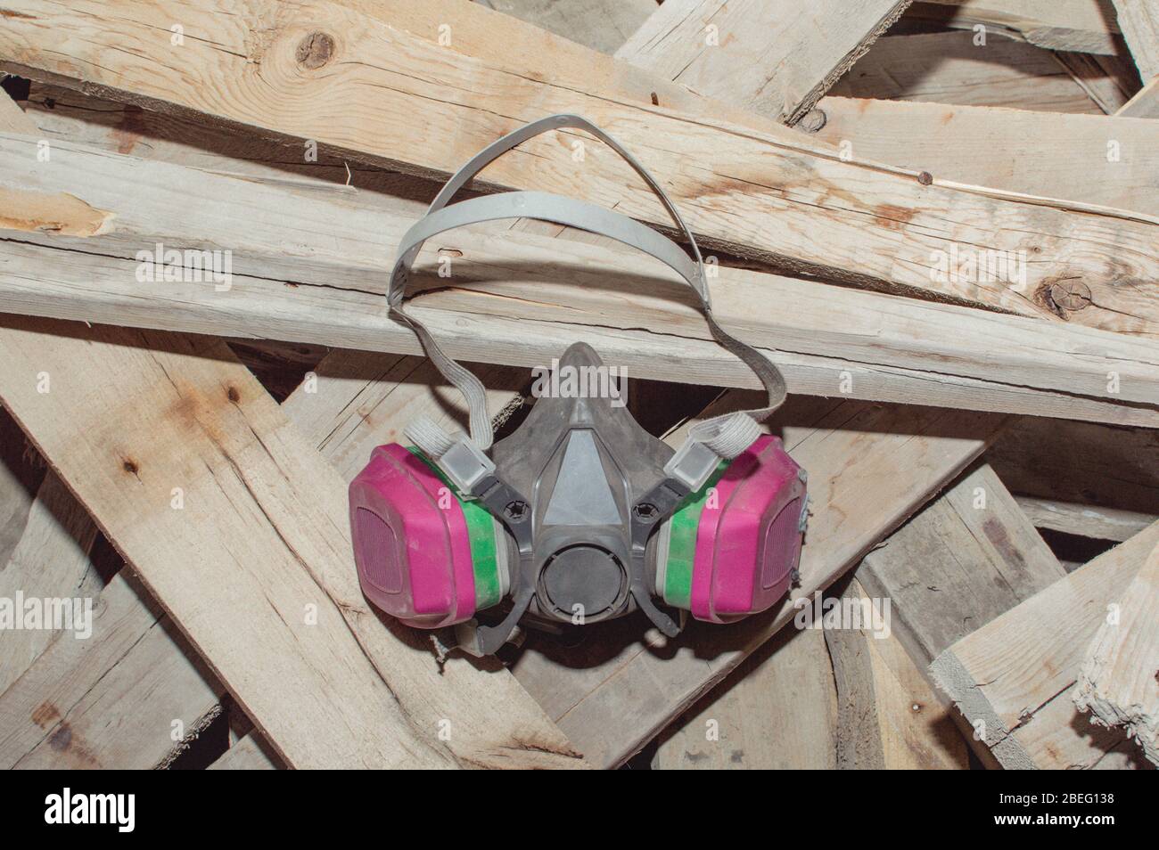 A professional breathing mask sitting on a pile of pallet wood Stock ...
