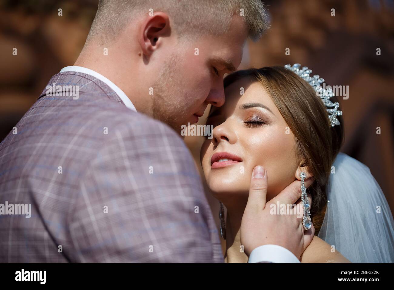 Bride and groom passionately hug on wedding day Stock Photo - Alamy