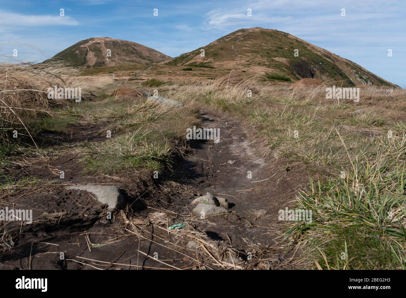 The path leading to the tops of the mountains. Two identical mountains ...
