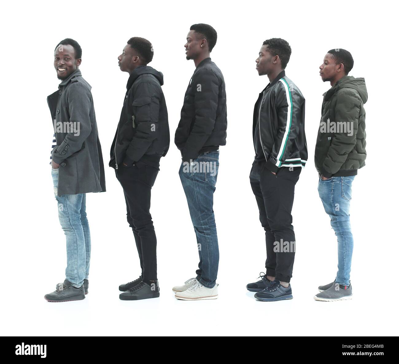 group of diverse guys standing in turns . isolated on white Stock Photo ...