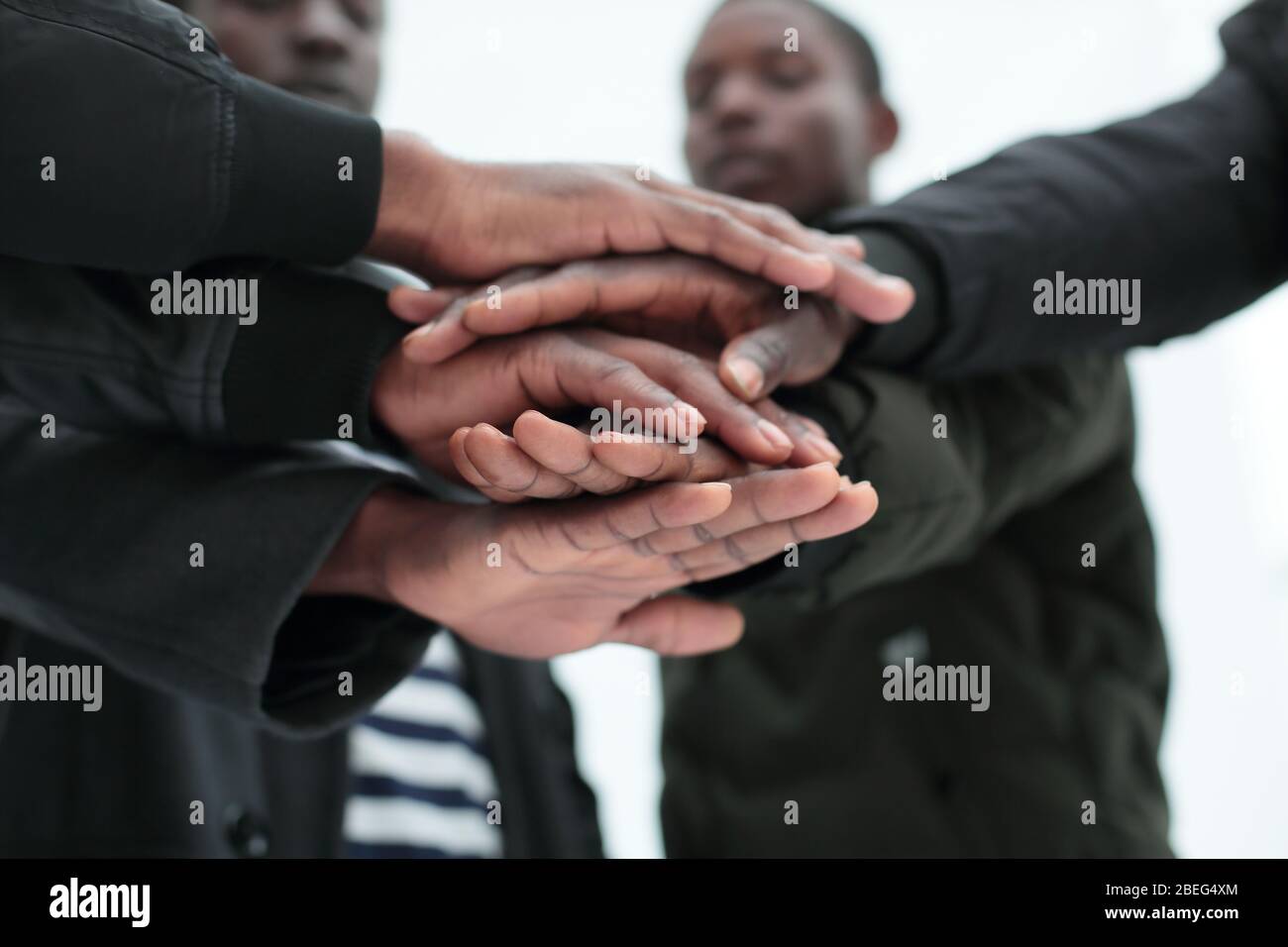 close up. a group of friends putting their hands togethe Stock Photo ...