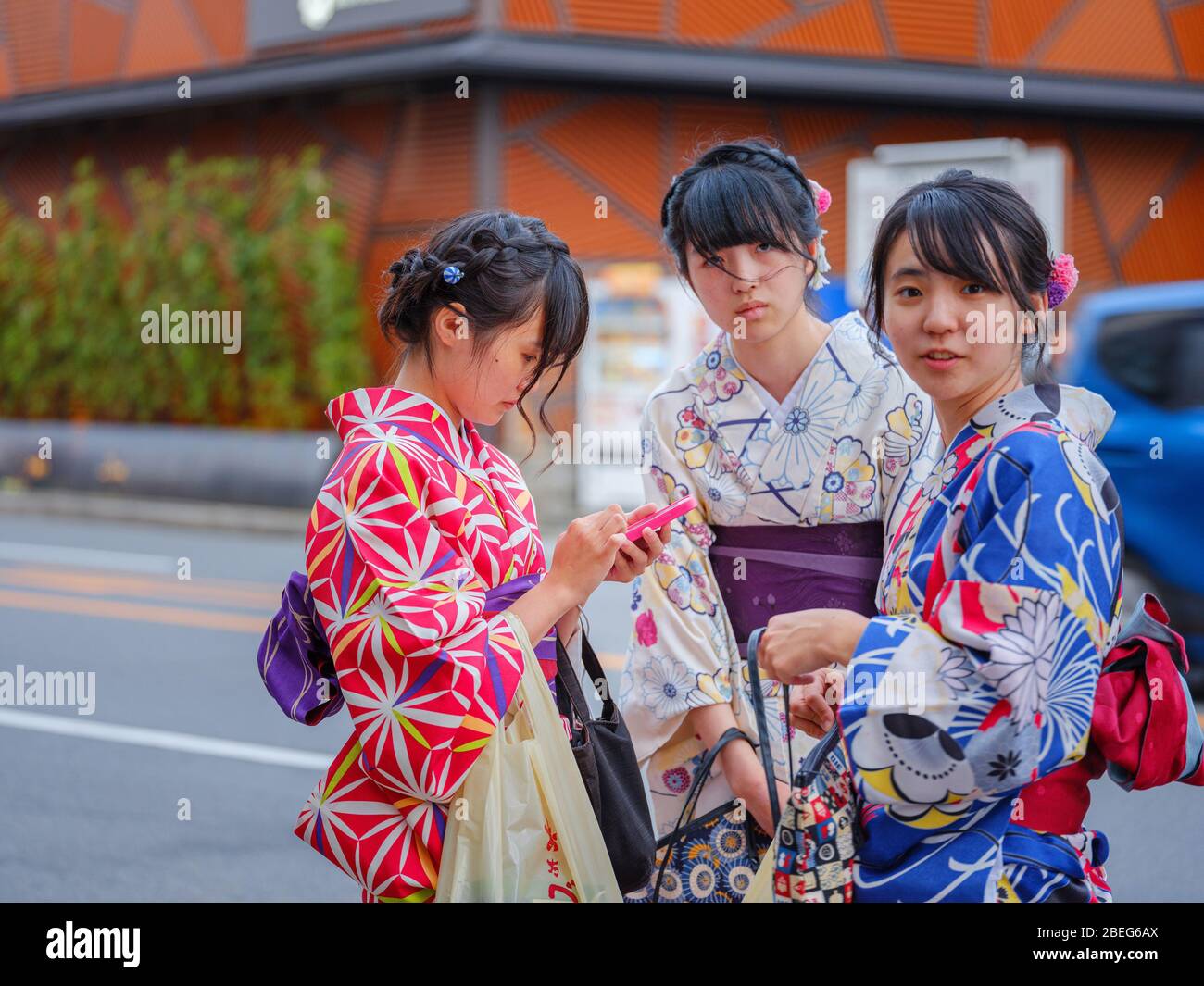 Japanese tourists and national costumes walk on the streets of Kyoto ...