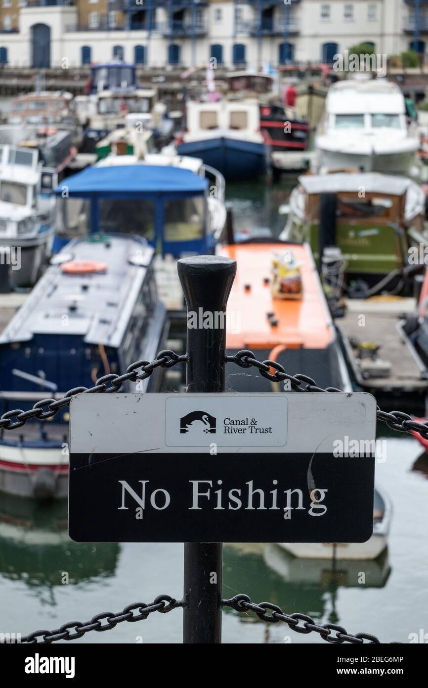 No Fishing Sign from the Canal and River Trust with boats moored in the ...