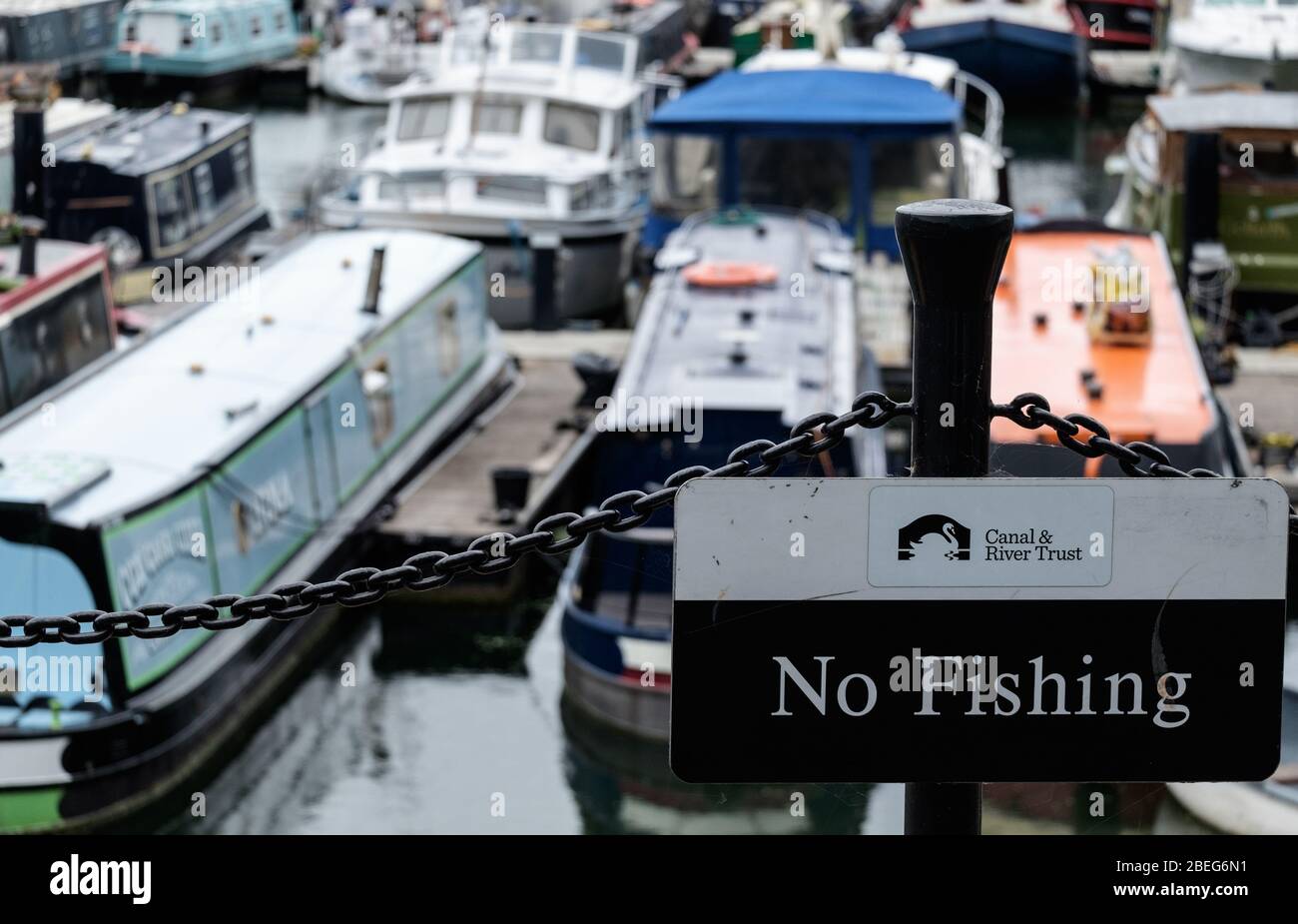 No Fishing Sign from the Canal and River Trust with boats moored in the ...