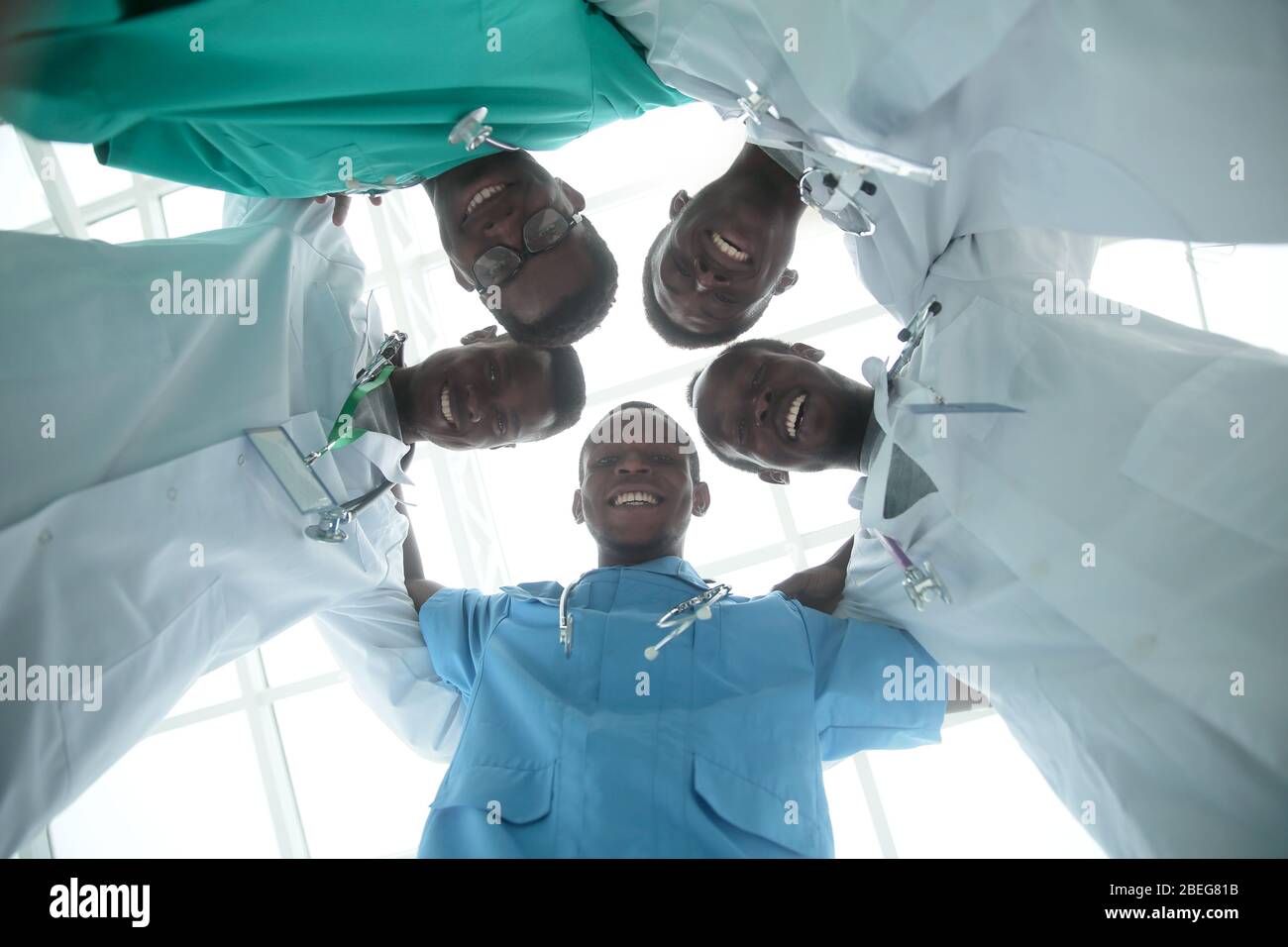bottom view. group of young doctors standing in a circle Stock Photo ...