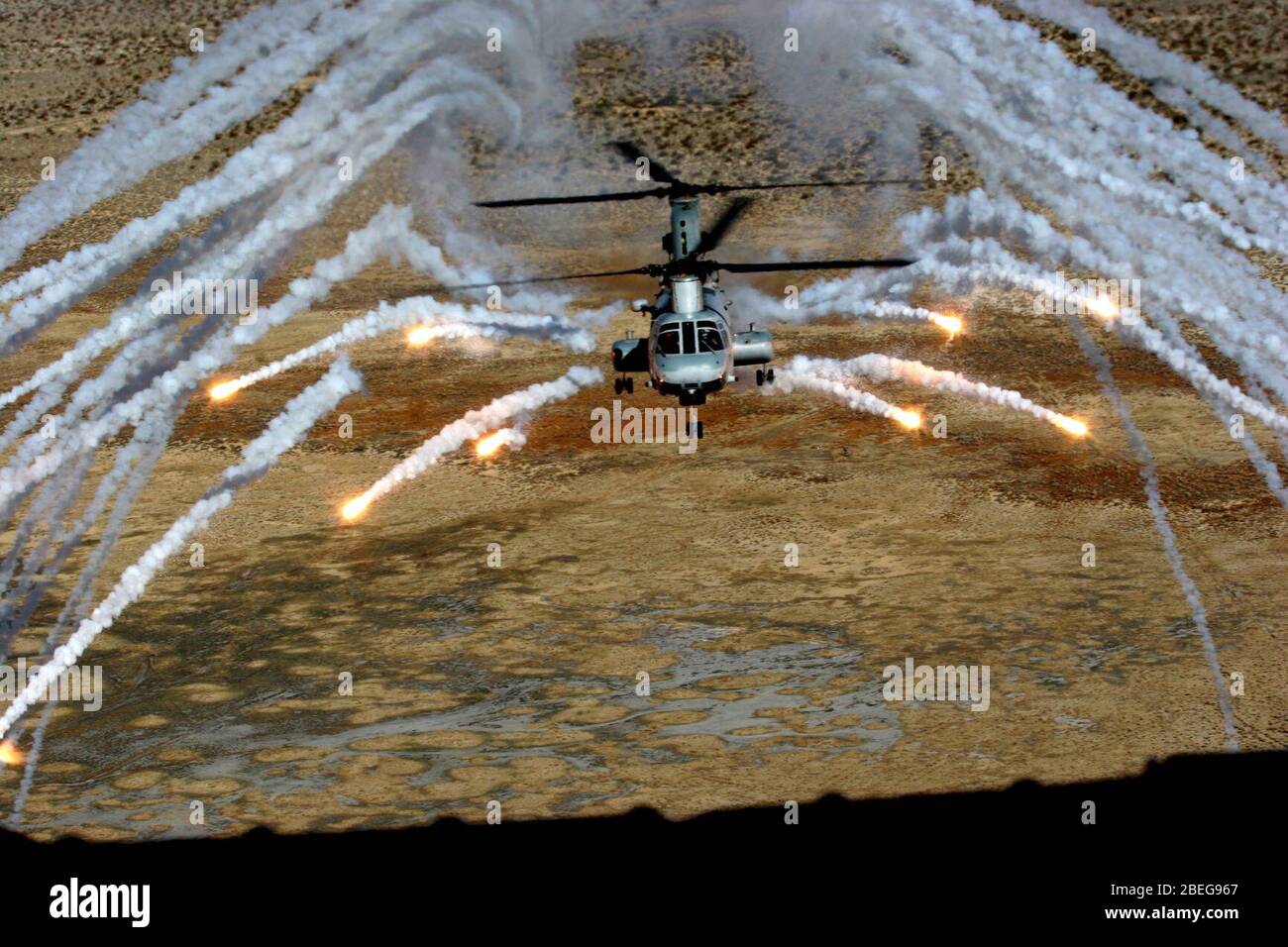 Helicopter and flares Stock Photo - Alamy
