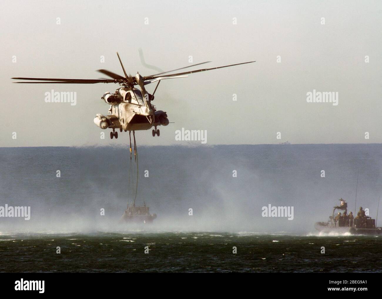 Helicopter Lifts a Rigid Hull Inflatable Boat Stock Photo - Alamy