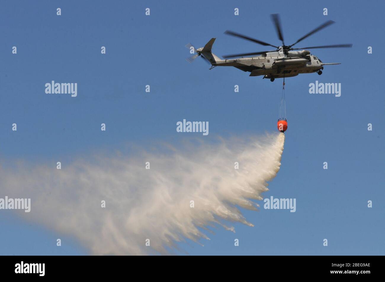 Helicopter drops water during exercise Stock Photo - Alamy