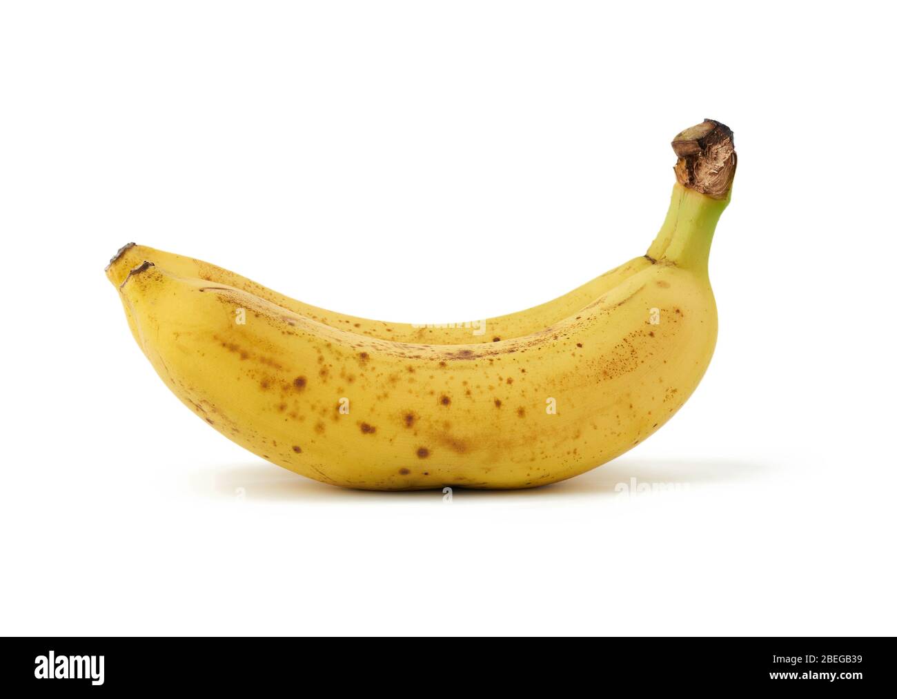 two yellow ripe bananas are isolated on a white background, on a peel a ...