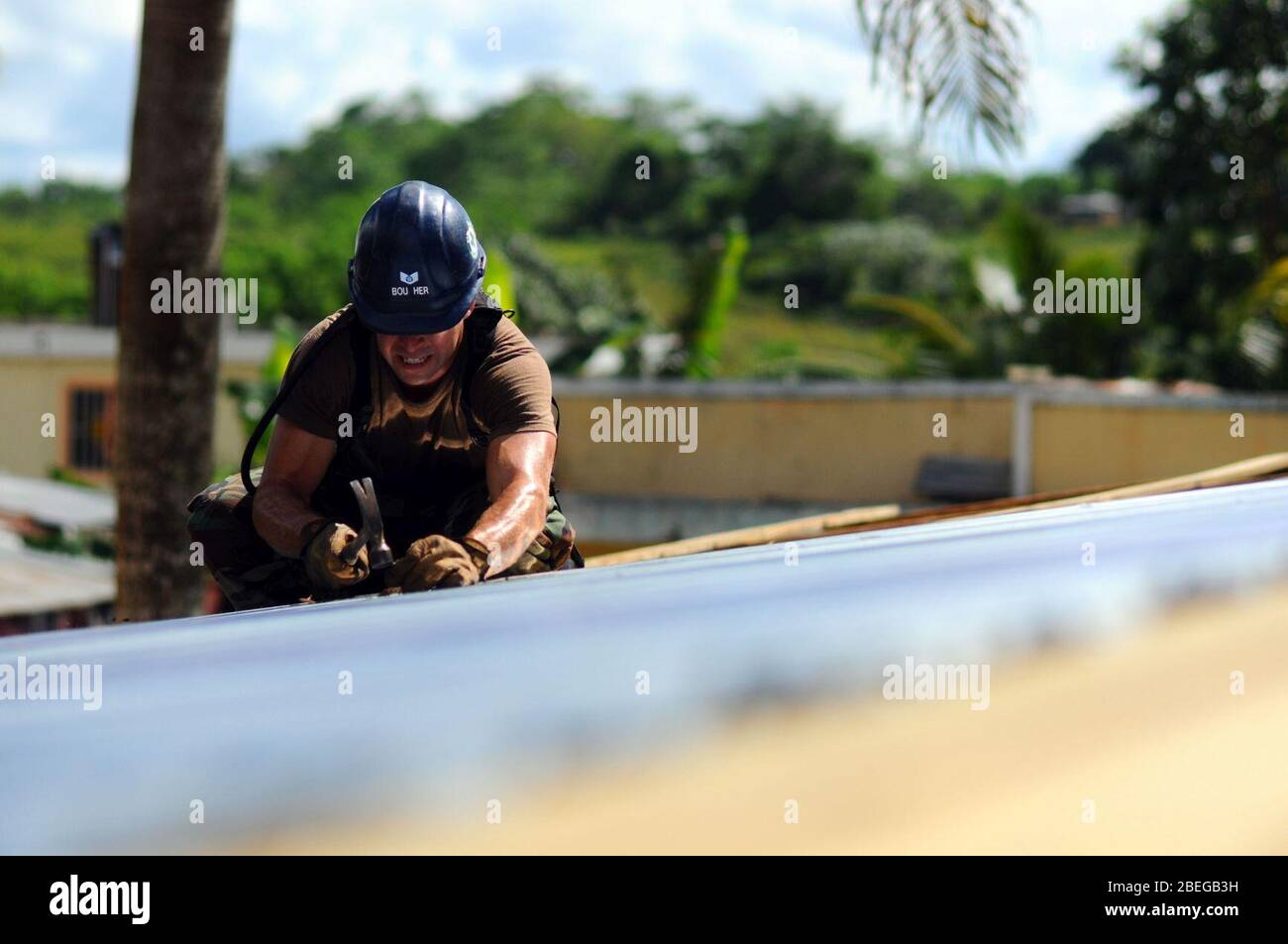Helping to build a school Stock Photo - Alamy