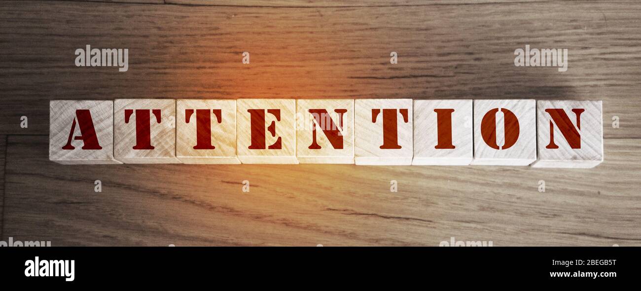 ATTENTION word made with building blocks. Alert awareness concept Stock ...
